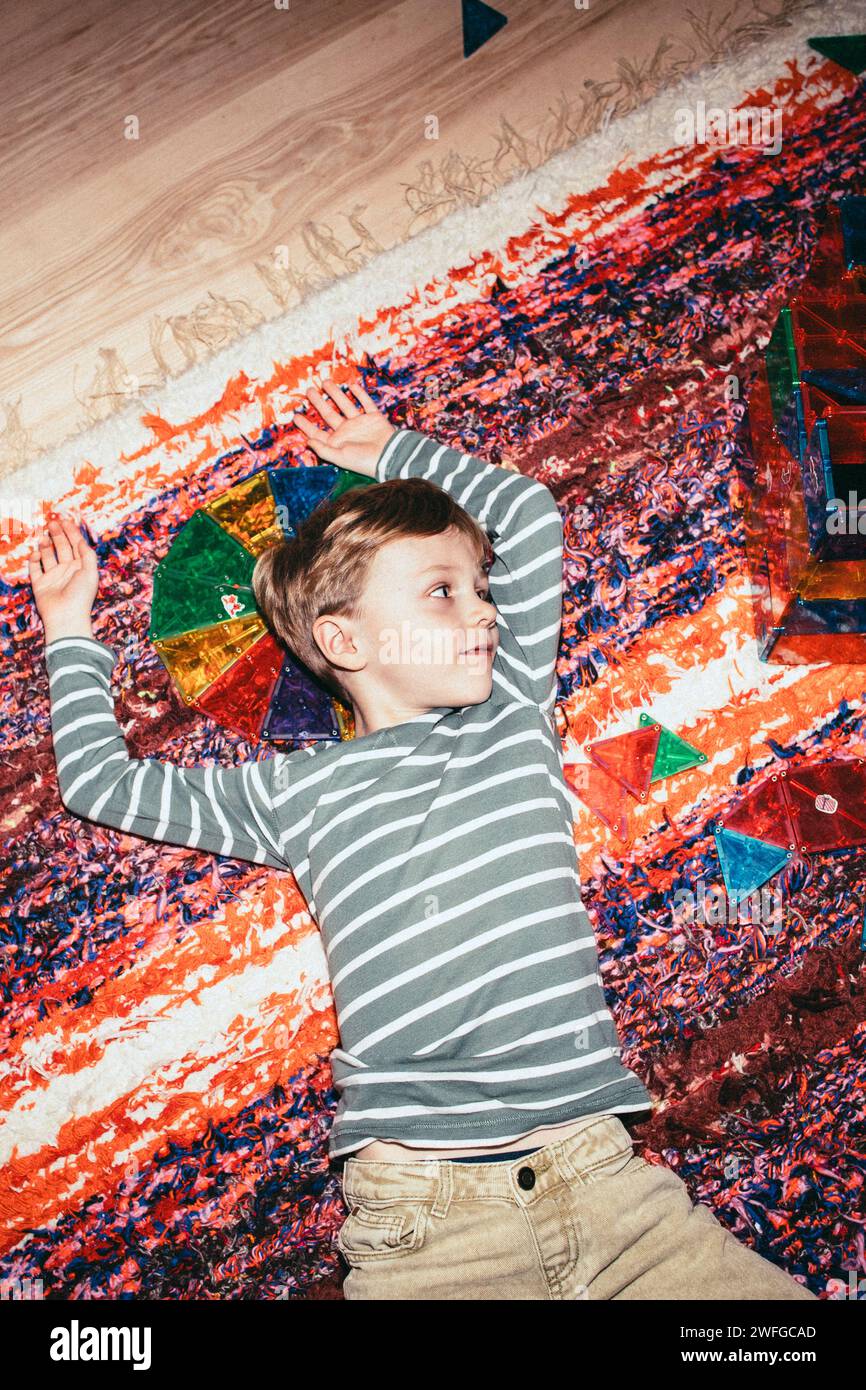 Boy lying down hi-res stock photography and images - Alamy