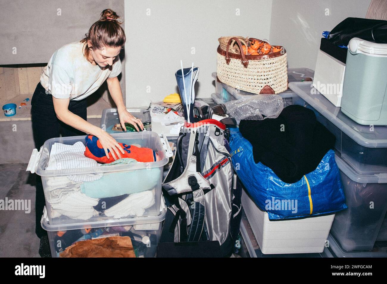 Woman sorting her clothes hi-res stock photography and images - Alamy