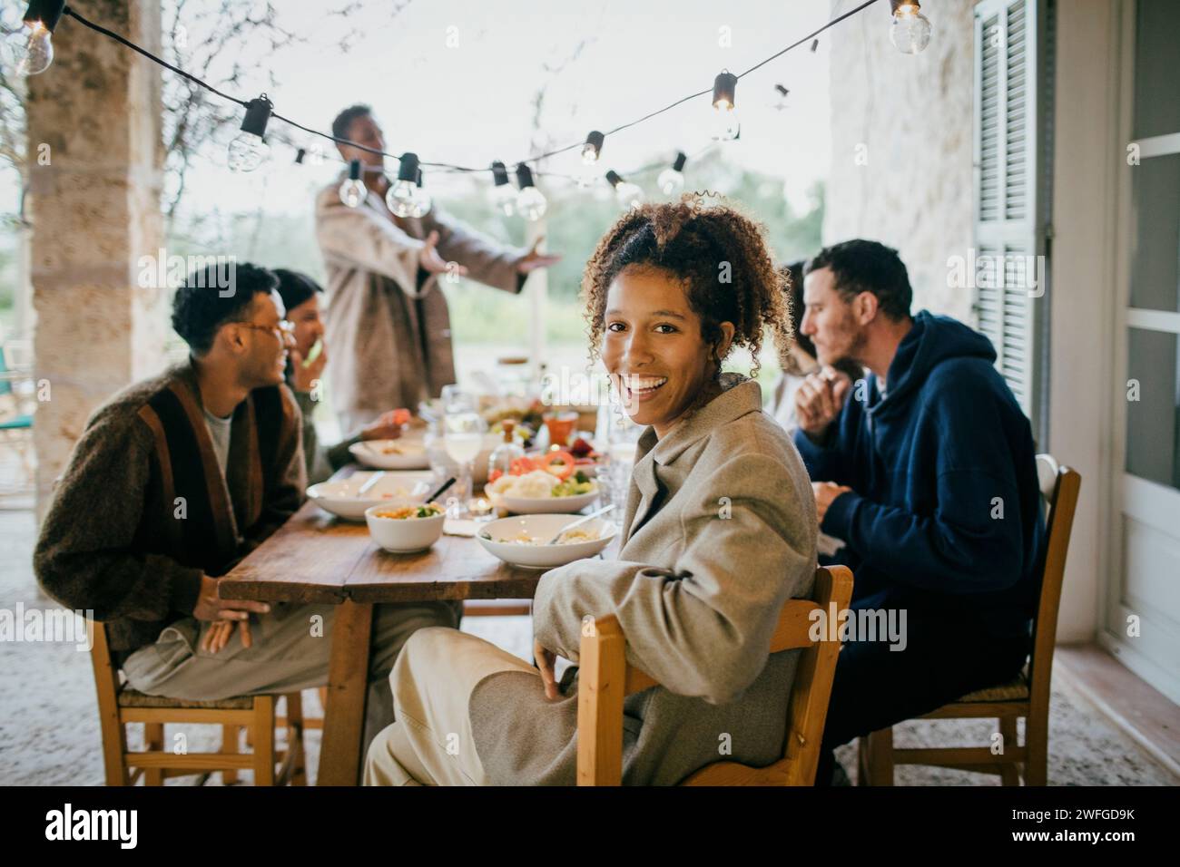 Young woman sitting dining table hi-res stock photography and images ...