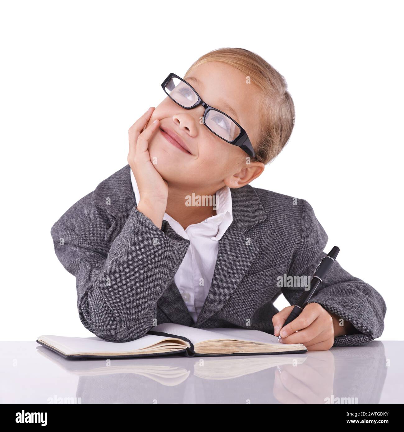 Young child, writing and dreaming in studio for business, career and ...