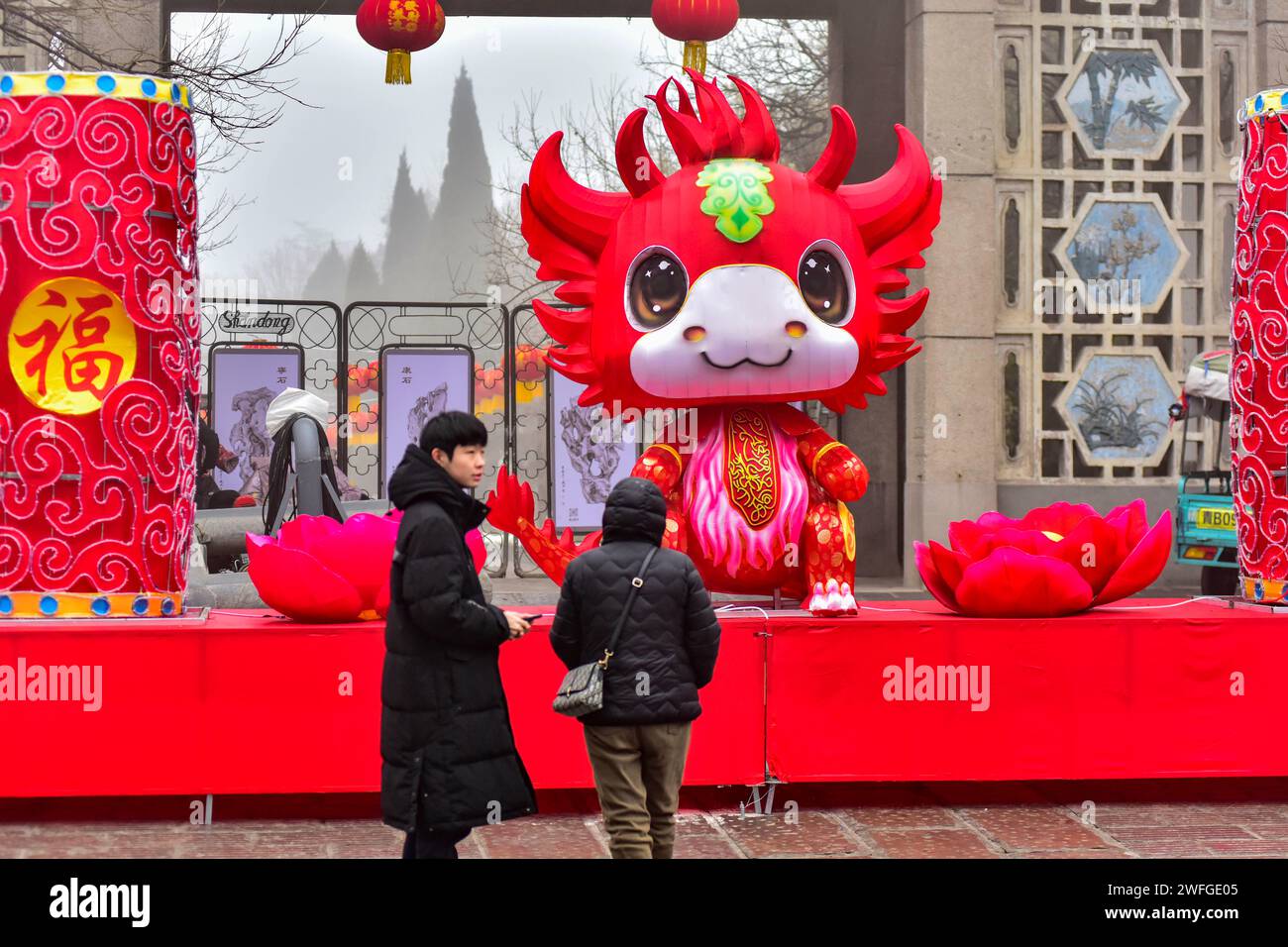 Tourists are viewing lanterns to celebrate the upcoming Spring Festival ...
