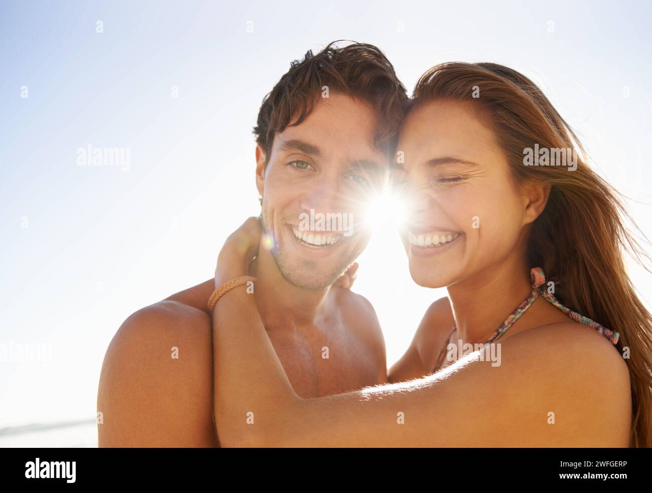 Love, laugh and couple hug at a beach with comic, humor or bonding ...