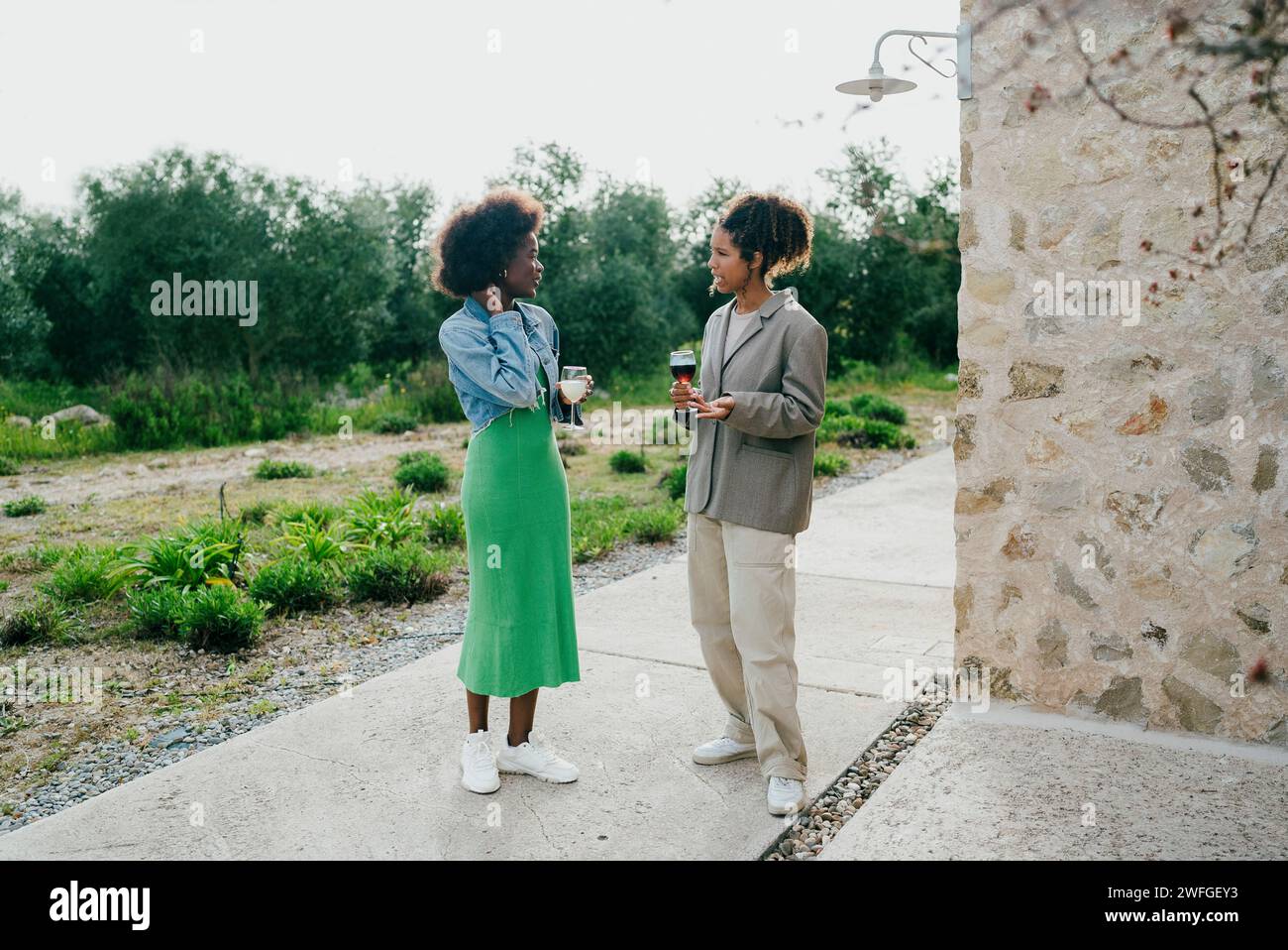 Woman gesturing talking friend hi-res stock photography and images - Alamy