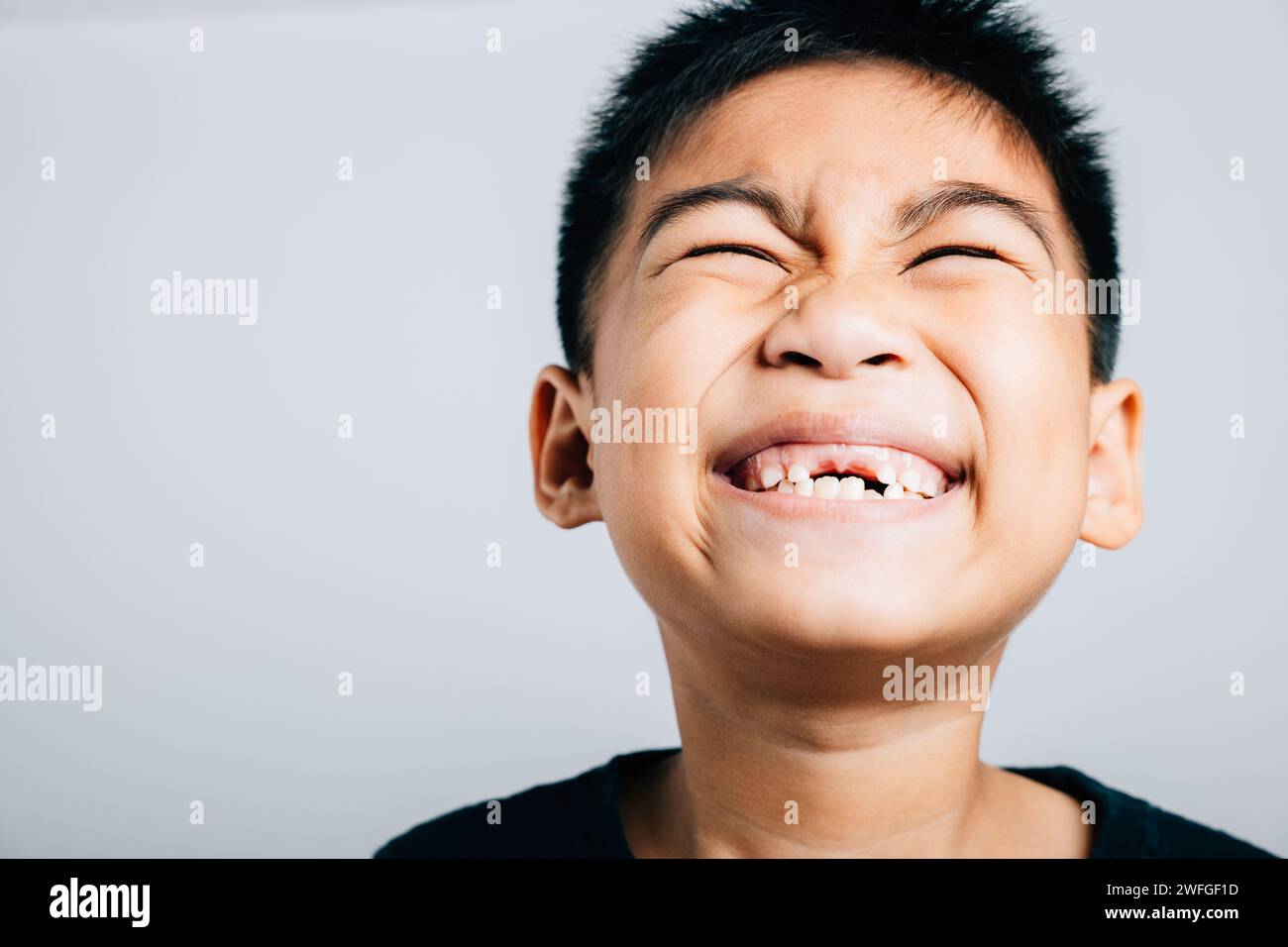 Cheerful schoolboy grin lost tooth gap. Child dental growth isolated on ...