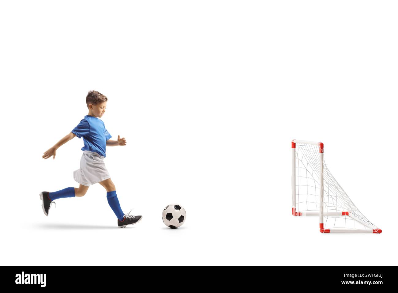 Boy running with a football to score a goal isolated on white ...