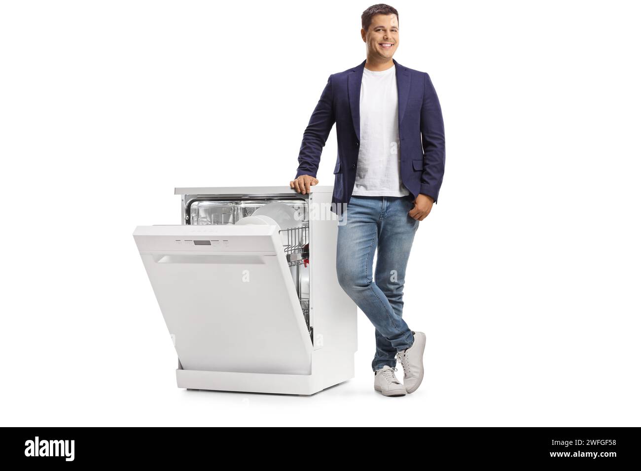 Man leaning on a half open white dishwasher and smiling isolated on ...