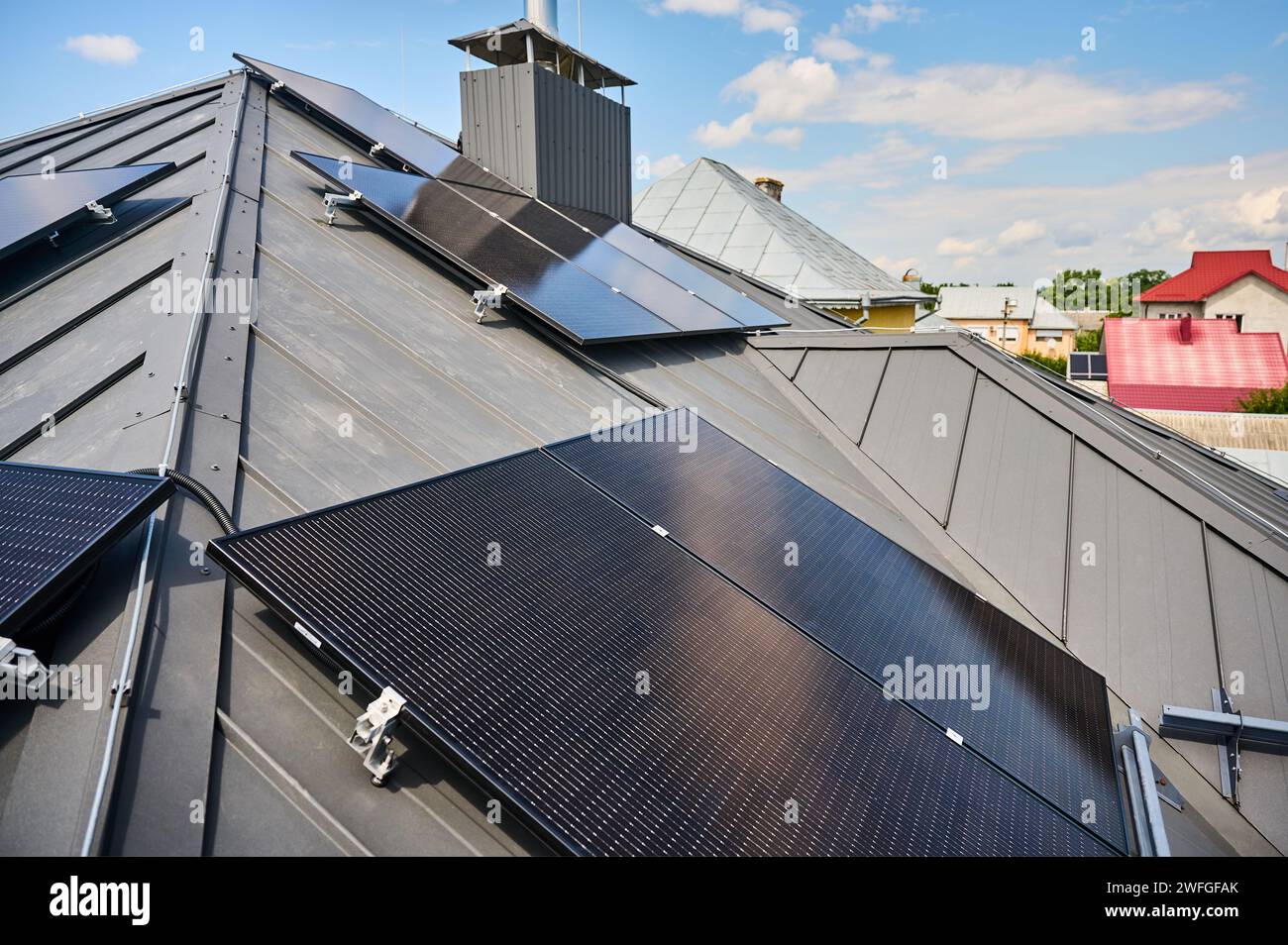 House with solar panels on rooftop for generating electricity through ...