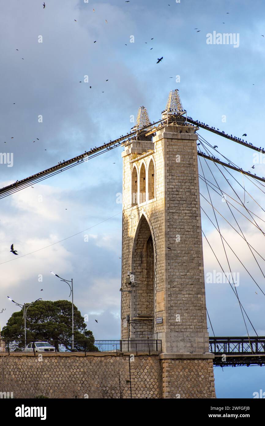 Low-angle view of Sidi M'Cid Bridge the suspension bridge in ...