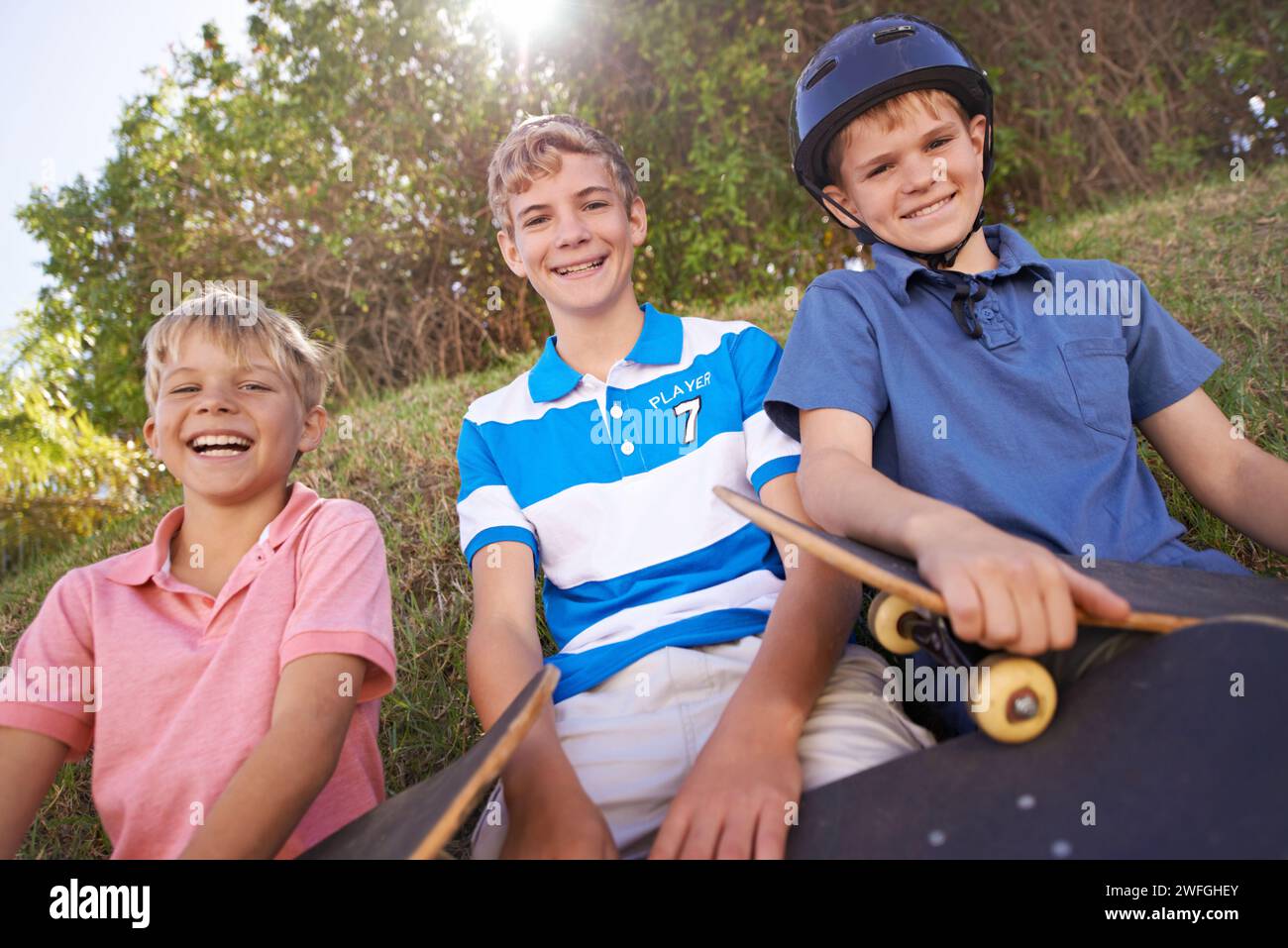 Friends, children and skateboard in outdoor portrait, brothers and ...
