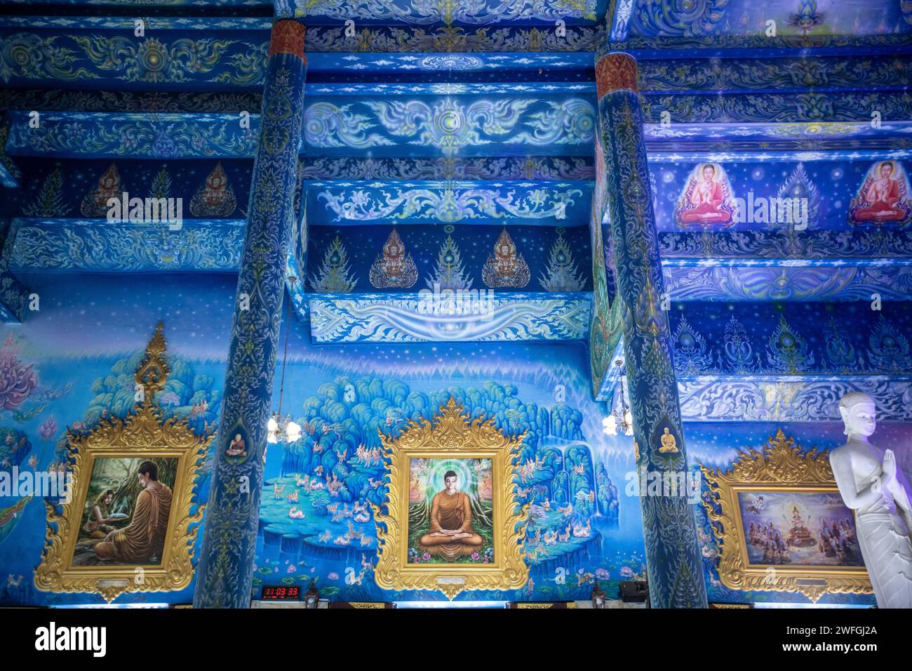 Paintings depicting Buddha's life inside the Blue Temple. Wat Rong Suea ...