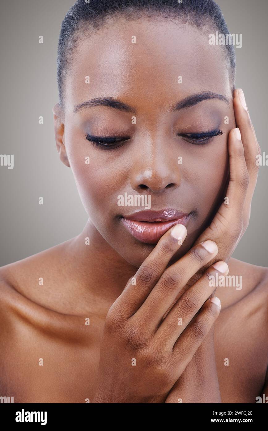 Beauty, nails and black woman with skincare and manicure on a gray ...
