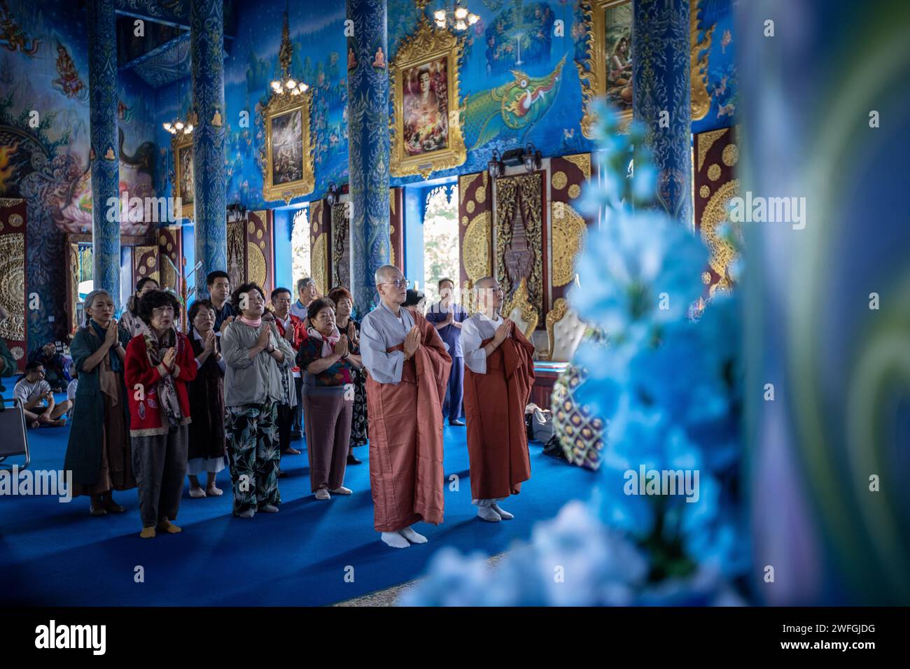 Chiang Rai, Thailand. 19th Jan, 2024. Buddhist nuns and Asian tourists ...