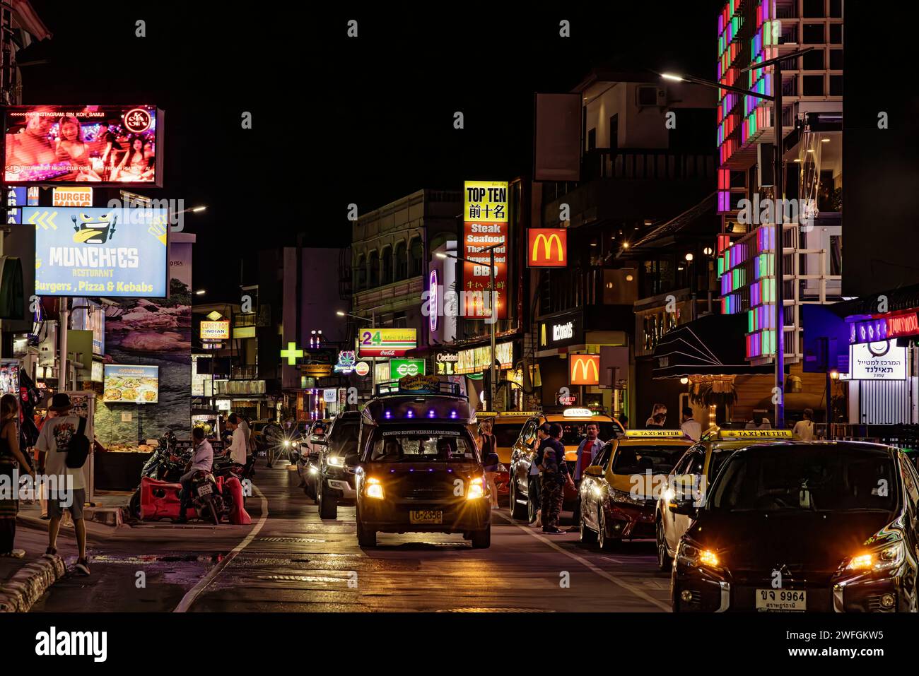 Traffic and neon signs on Chaweng Beach Road at night, Ko Samui ...