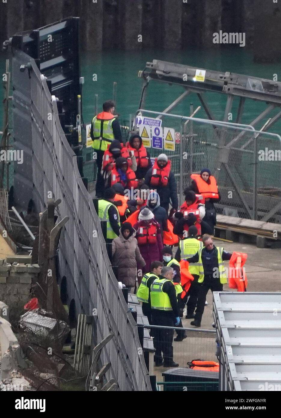 A group of people thought to be migrants are brought in to Dover, Kent ...