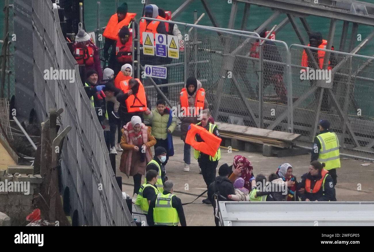 A group of people thought to be migrants are brought in to Dover, Kent ...