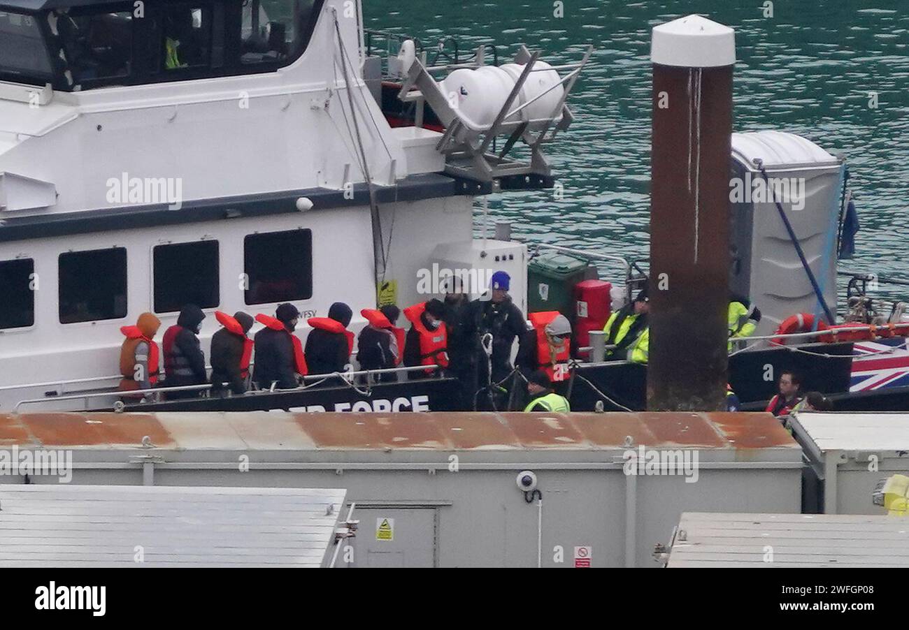 A group of people thought to be migrants are brought in to Dover, Kent ...
