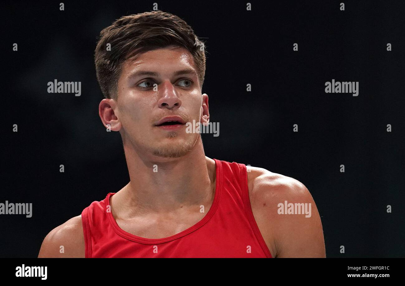 England's Patris Mughalzai in action during his Light Welter weight quarter-final match against ...