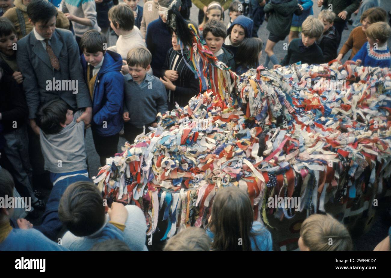 Minehead Hobby Horse, "Booting" ceremony at Cher on last evening a boy ...
