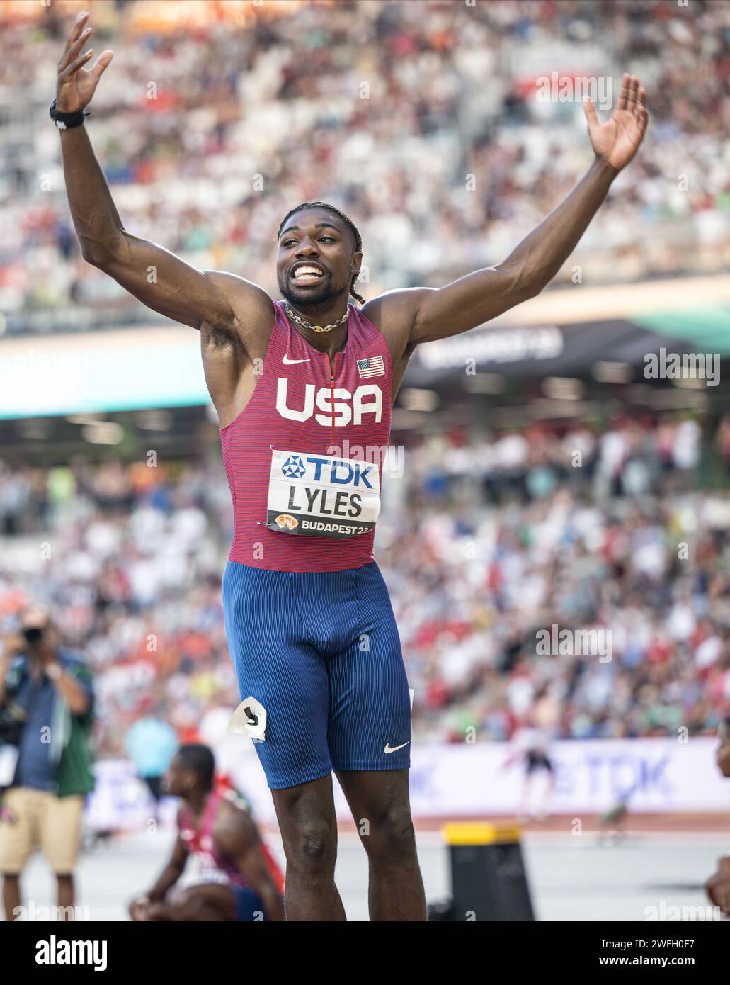 Noah Lyles celebrating his medal with the flag in the Budapest 2023 ...