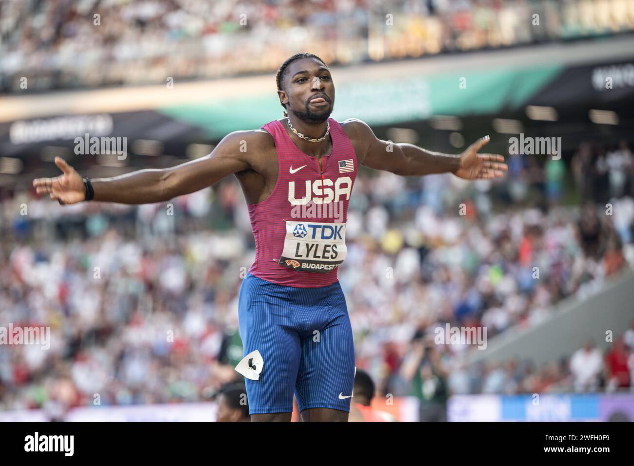 Noah Lyles celebrating his medal with the flag in the Budapest 2023 ...