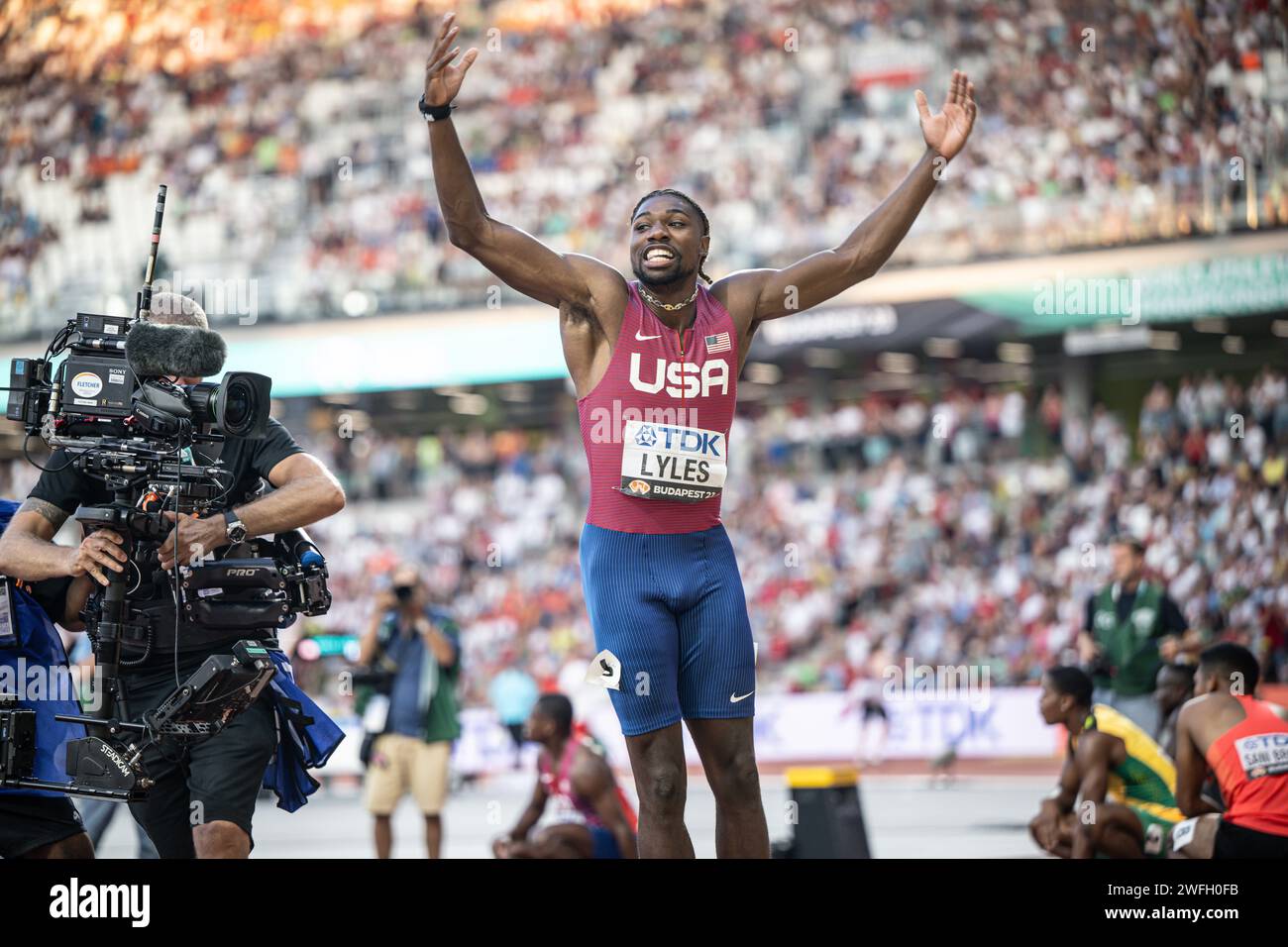 Noah Lyles celebrating his medal with the flag in the Budapest 2023 World Athletics ...