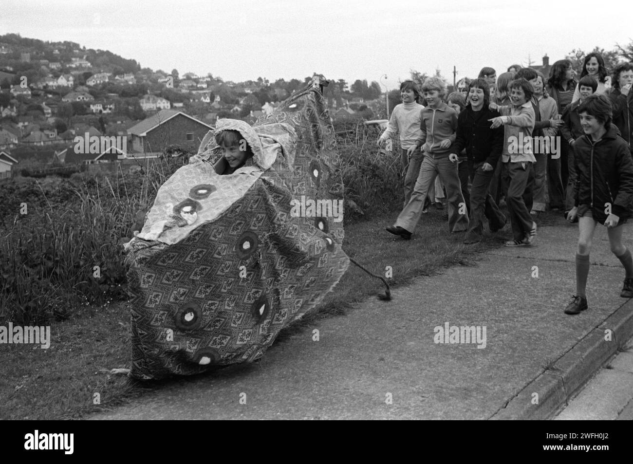 Minehead Hobby Horse, a young boy has made his own Obby Oss and is ...