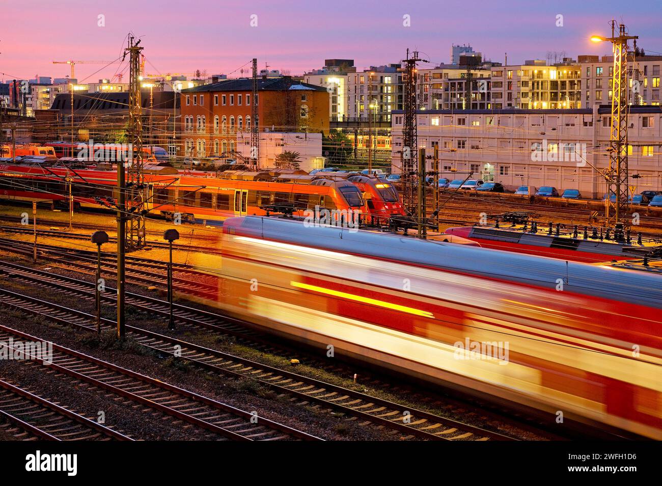 Double-decker Local train in motion at sunset, Germany, Hesse ...