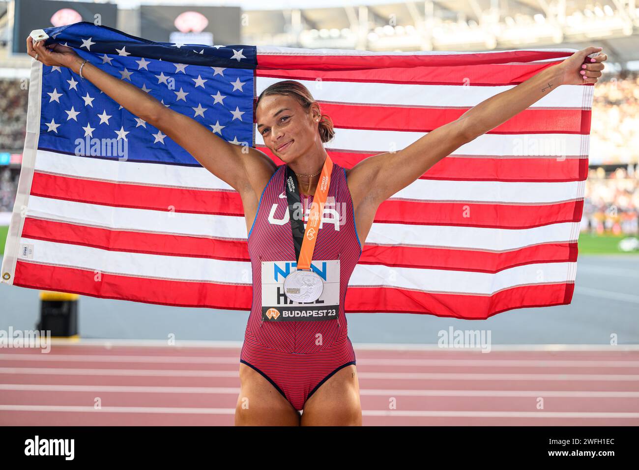 Anna HALL celebrating his medal with the flag in the Budapest 2023 ...