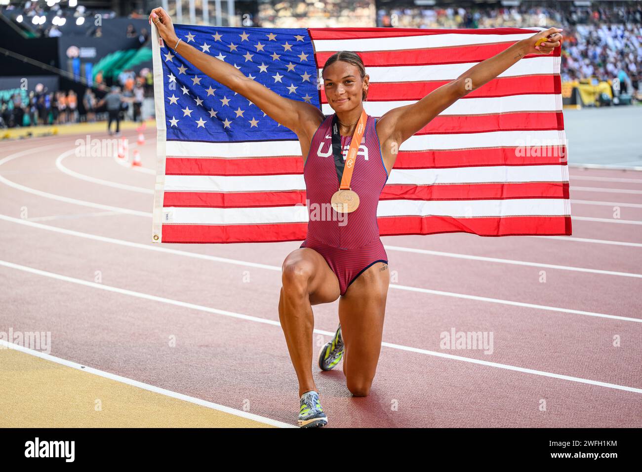 Anna HALL celebrating his medal with the flag in the Budapest 2023 ...