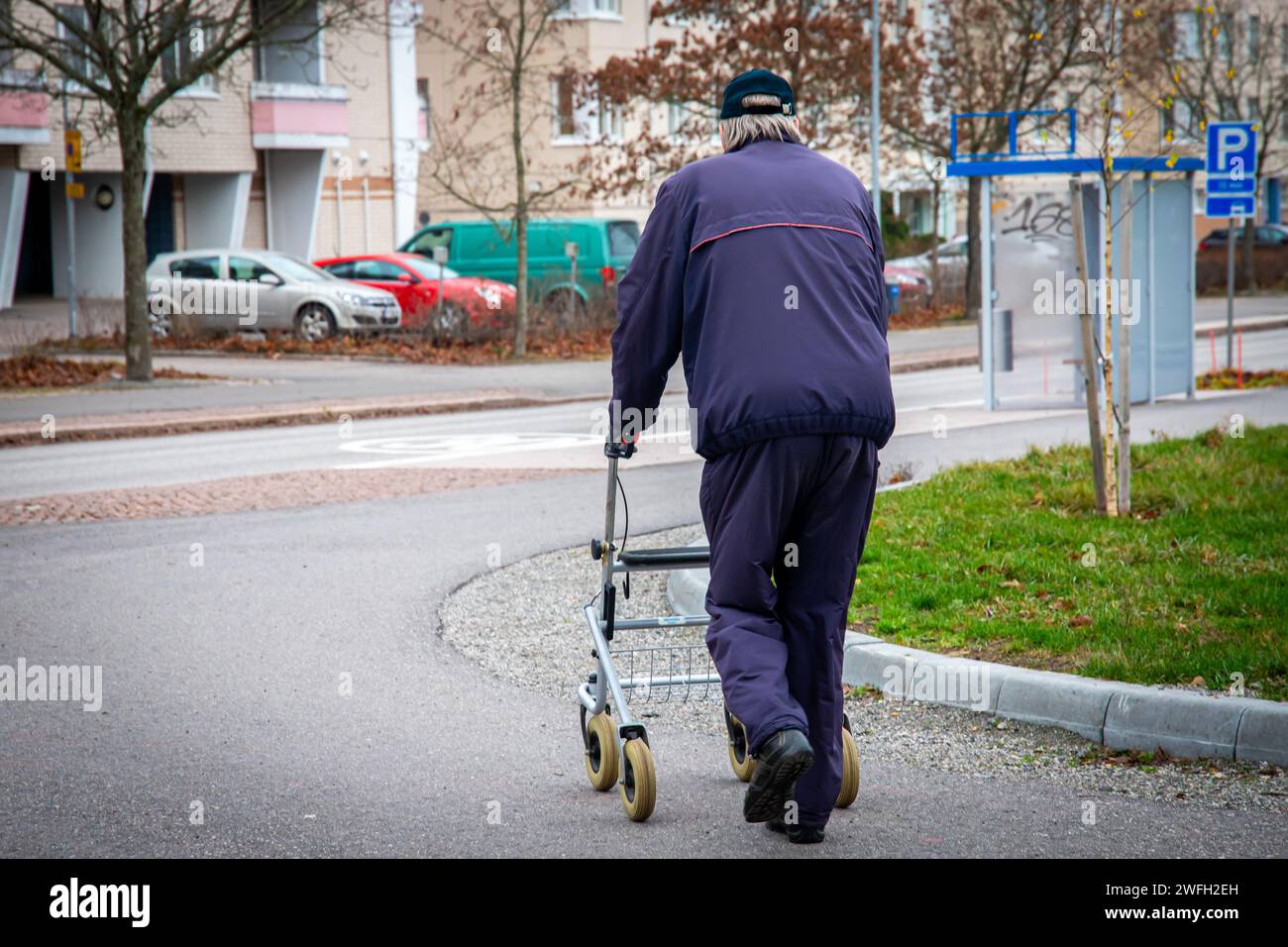 an elder man walking outdoors with rollator Stock Photo - Alamy