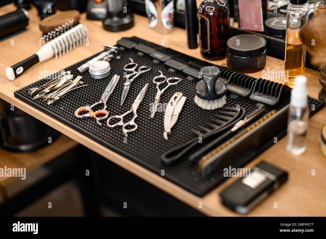 Barbers tools for mens haircuts laid out on a table close up. Set of ...