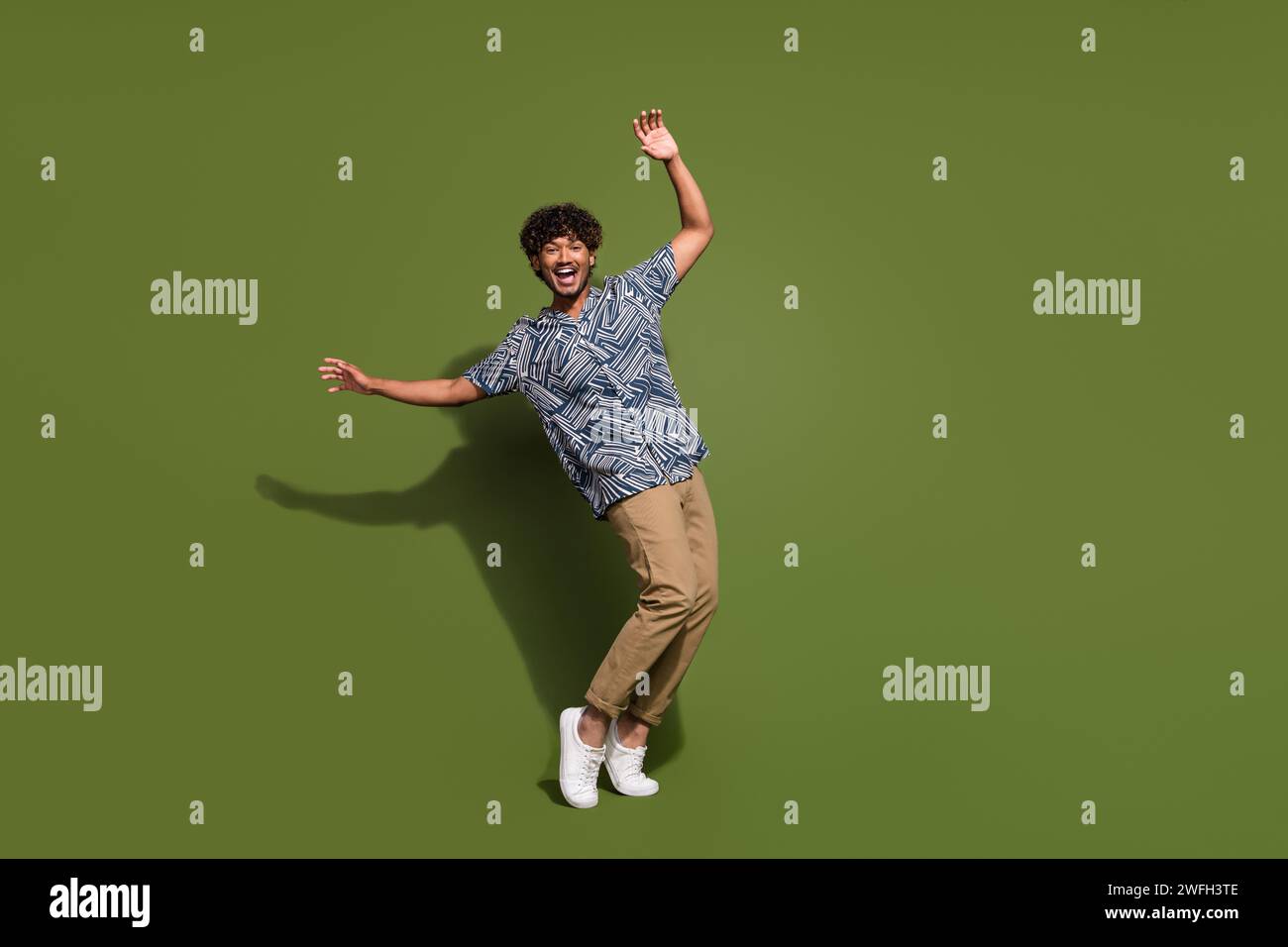 Full length photo of young funky guy chilling raised hands up and ...