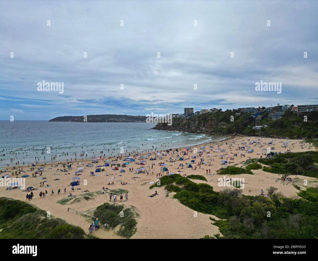 An aerial view of a crowd enjoying Freshwater Beach, Freshwater, NSW ...