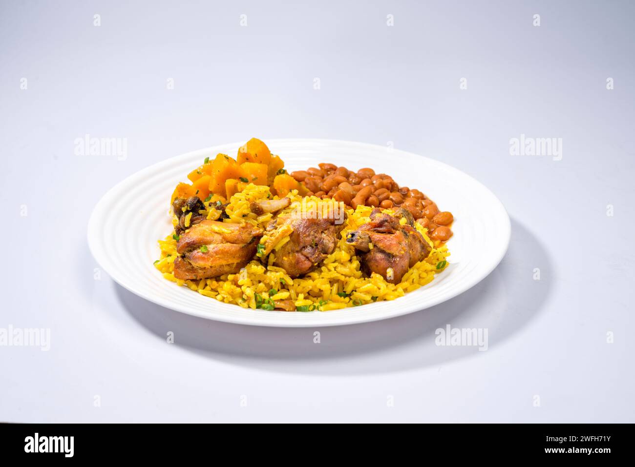 typical brazilian dish ( galinhada ) with curcuma seasoned, chicken and ...