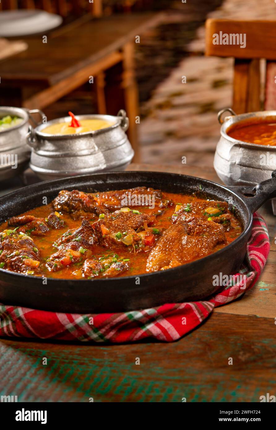tipical brazilian recipe with farm chicken, gravy, rice and okra ...