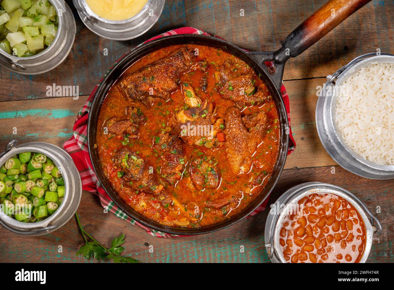 tipical brazilian recipe with farm chicken, gravy, rice and okra ...