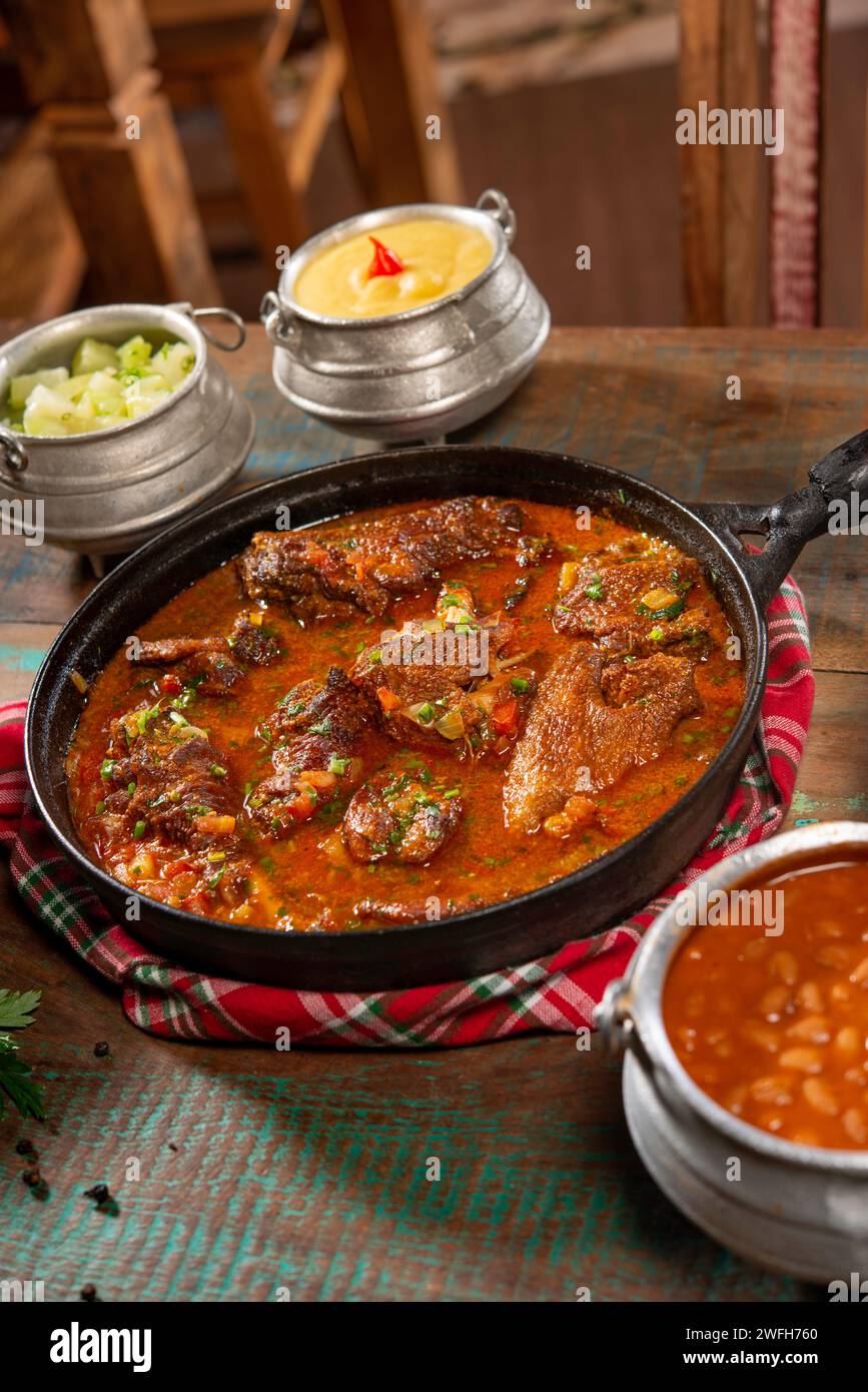 tipical brazilian recipe with farm chicken, gravy, rice and okra ...