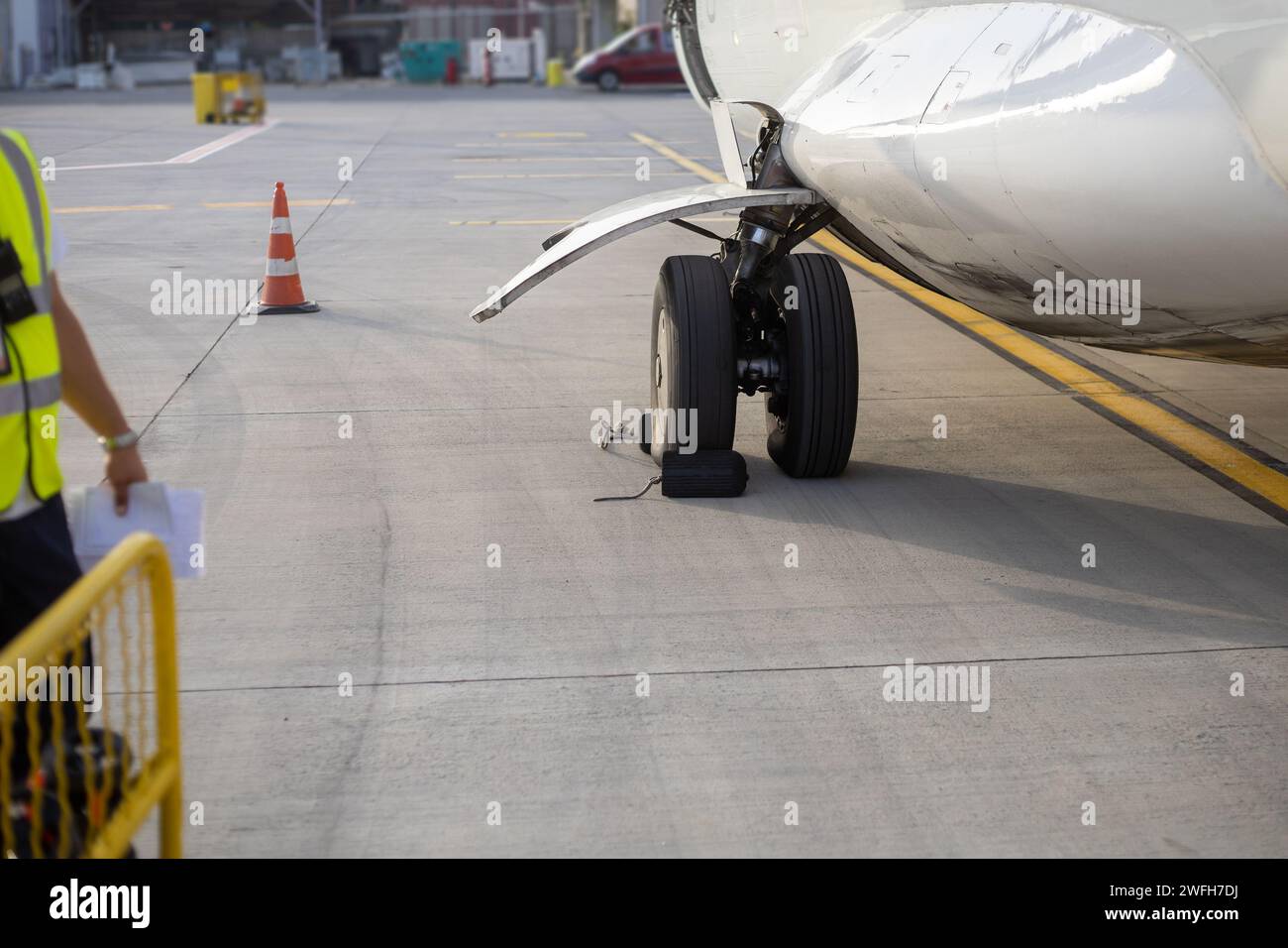 attached airplane wheel security stopper Stock Photo - Alamy