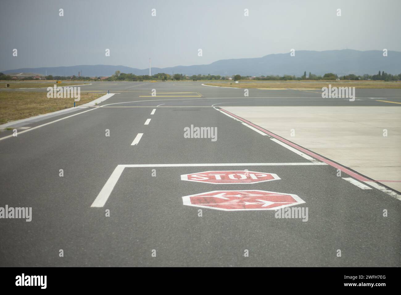 stop sign on airport runway Stock Photo - Alamy