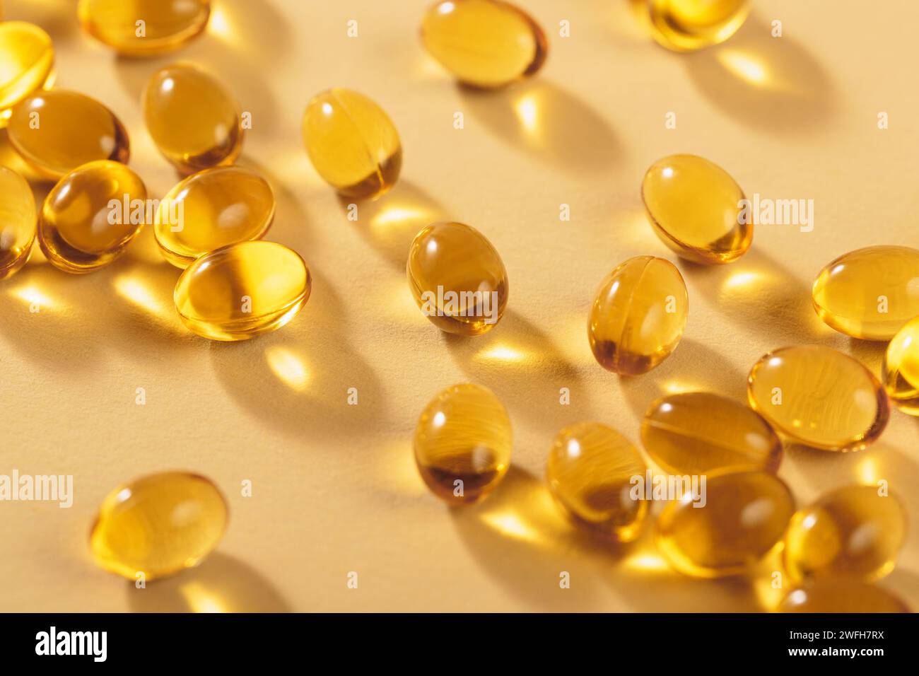 Little oil filled yellow softgels capsules of food supplements Stock ...