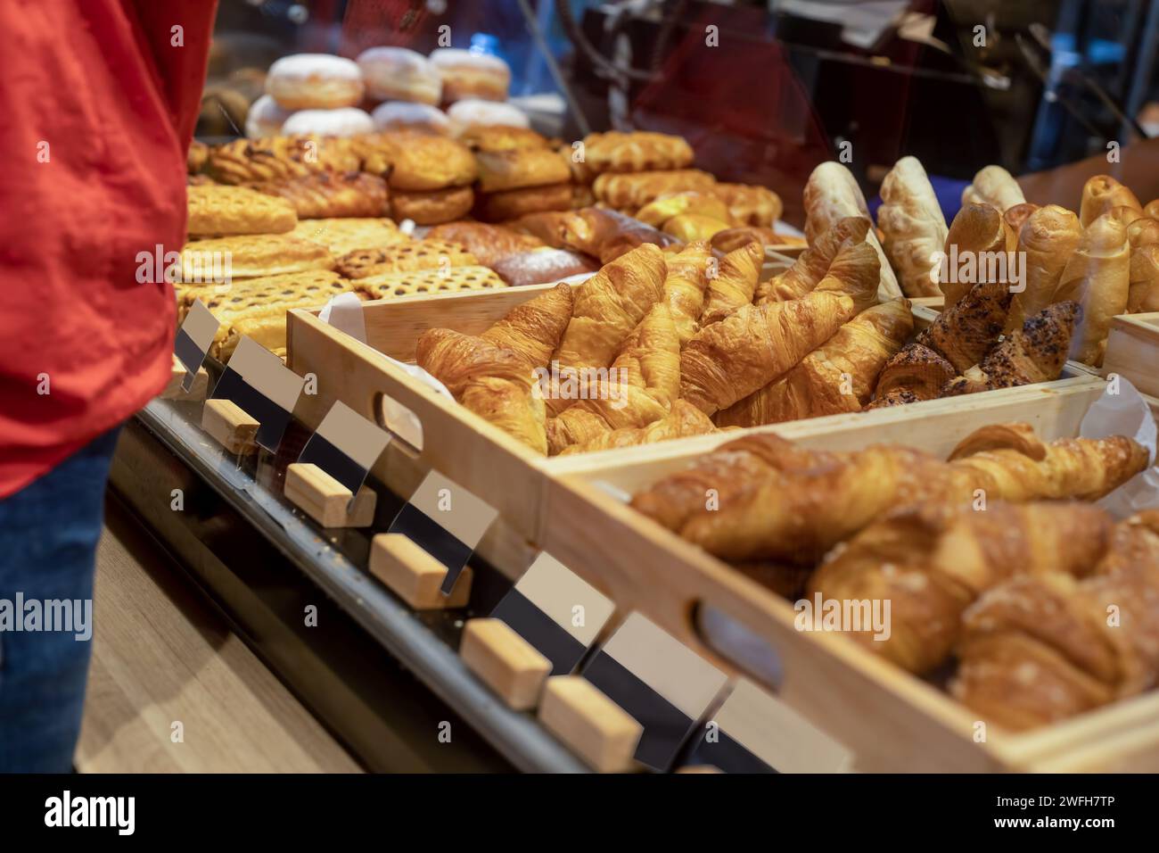 croissants displayed in bakery window Stock Photo - Alamy