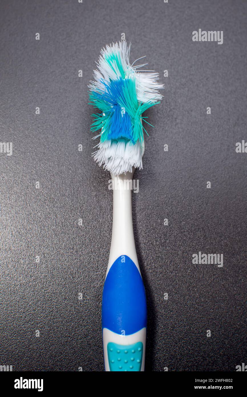 used toothbrush isolated on dark background Stock Photo - Alamy