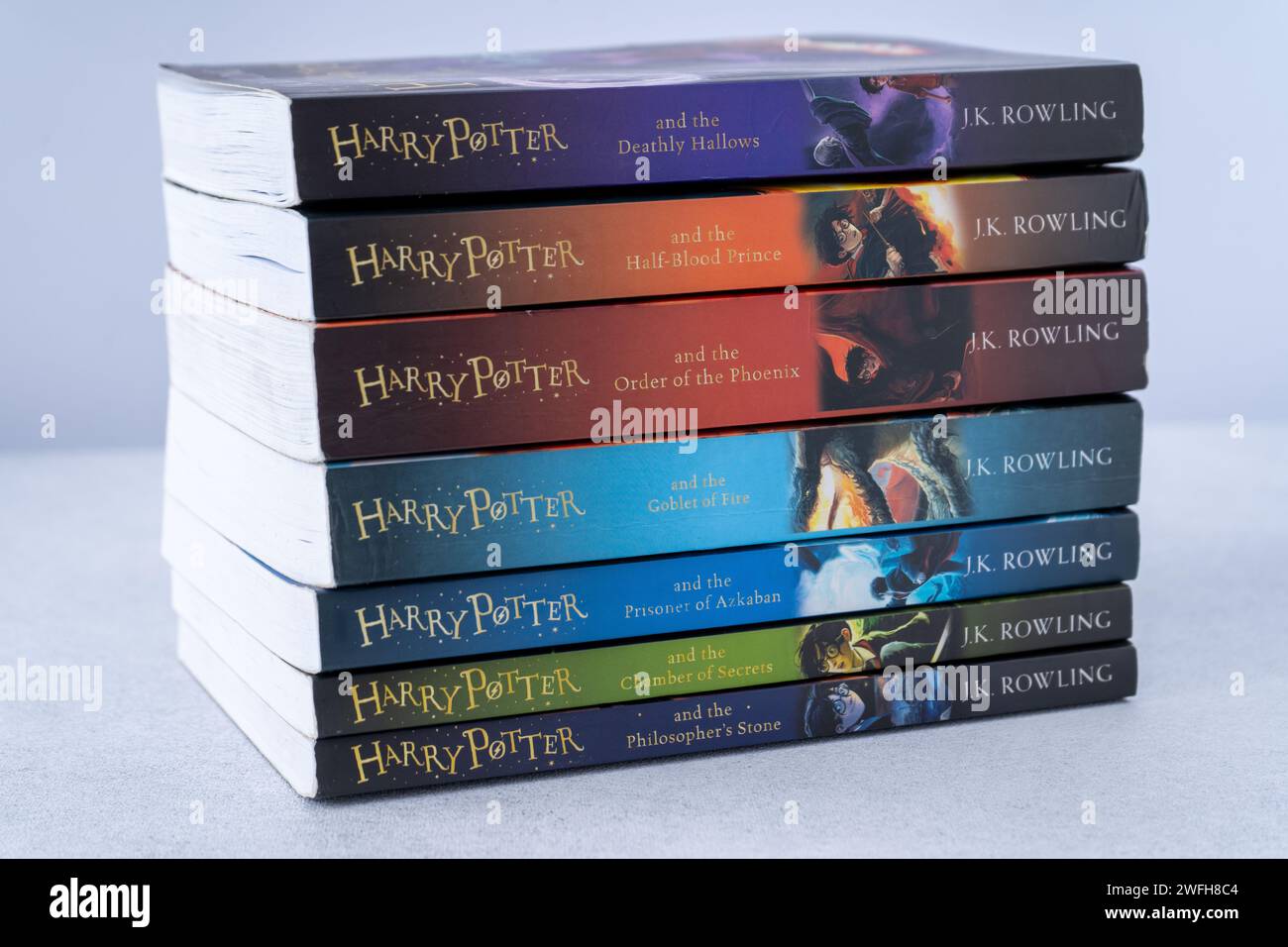 A stack of books about Harry Potter by writer JK Rowling. Collection ...