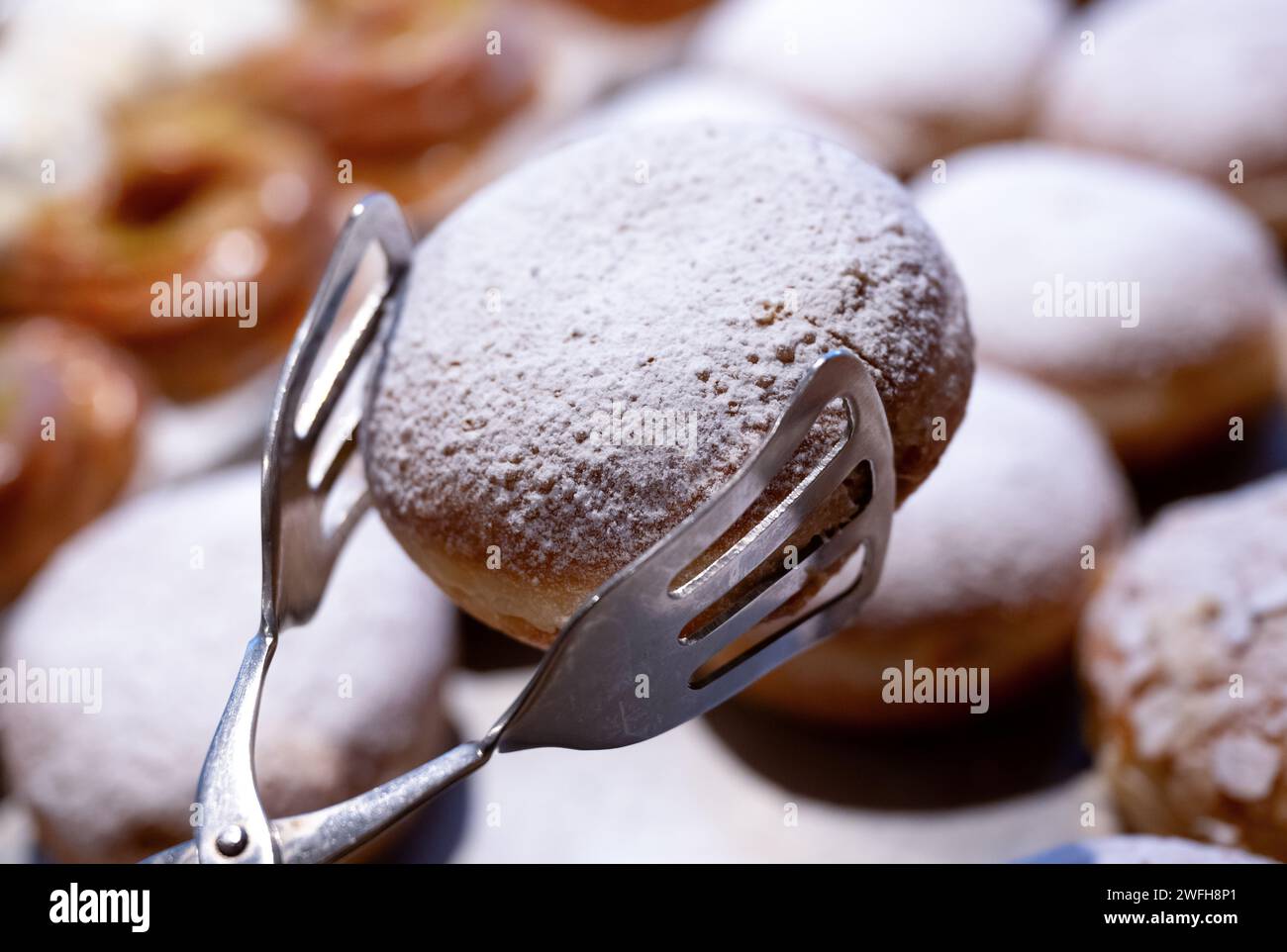 Munich, Germany. 31st Jan, 2024. Various doughnuts are on display at ...