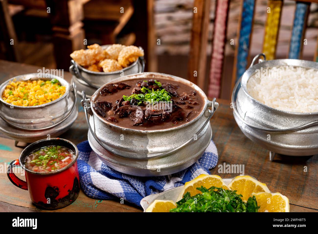 Typical Brazilian dish feijoada based on black beans and pork with ...