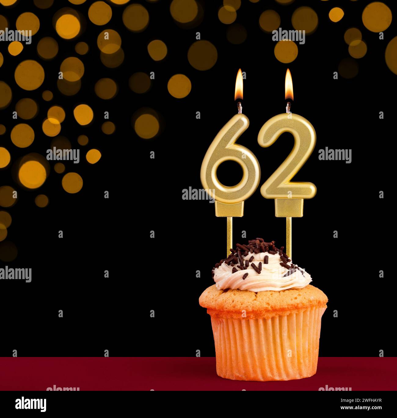 Birthday candle with cupcake - Number 62 on black background with out ...