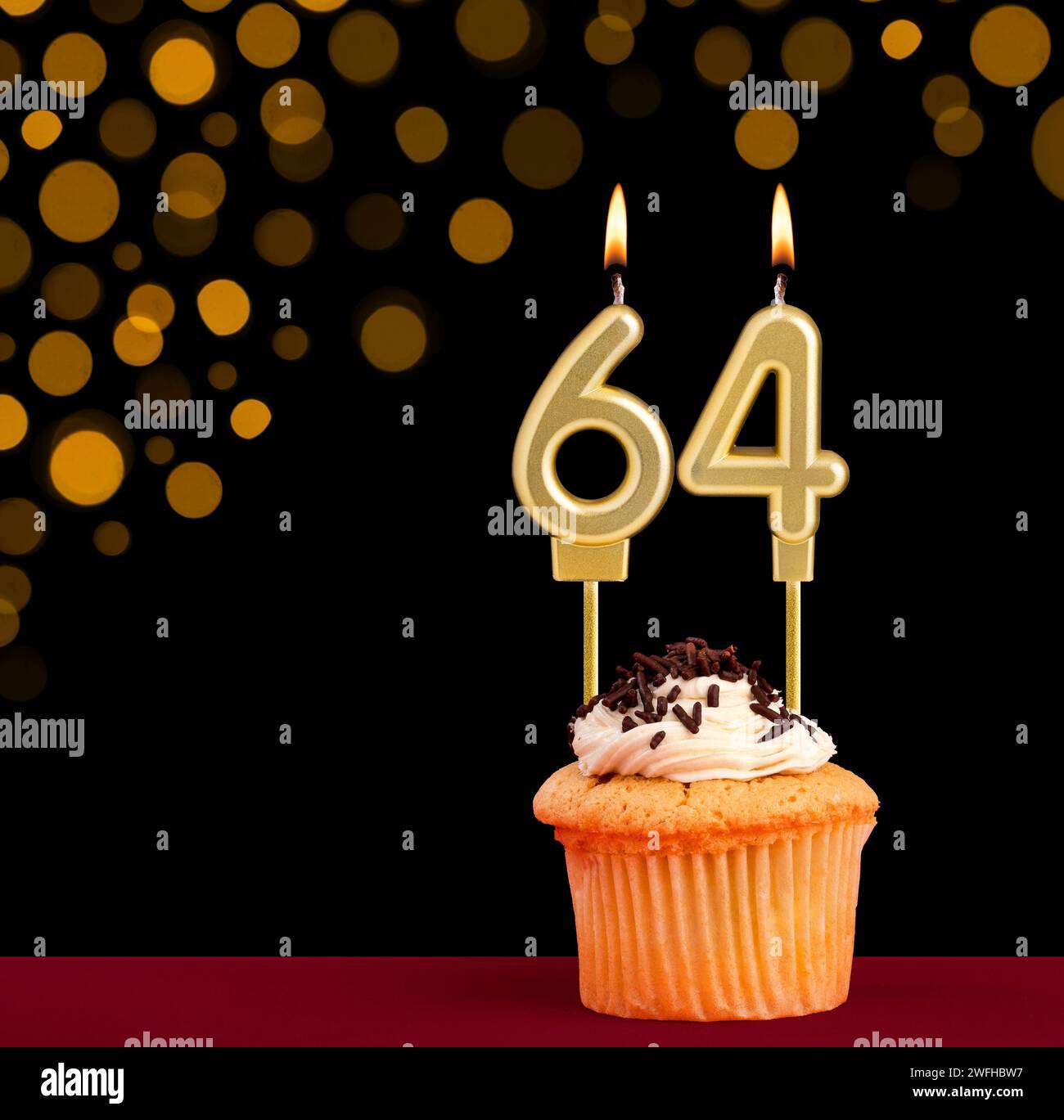 Birthday candle with cupcake - Number 64 on black background with out ...