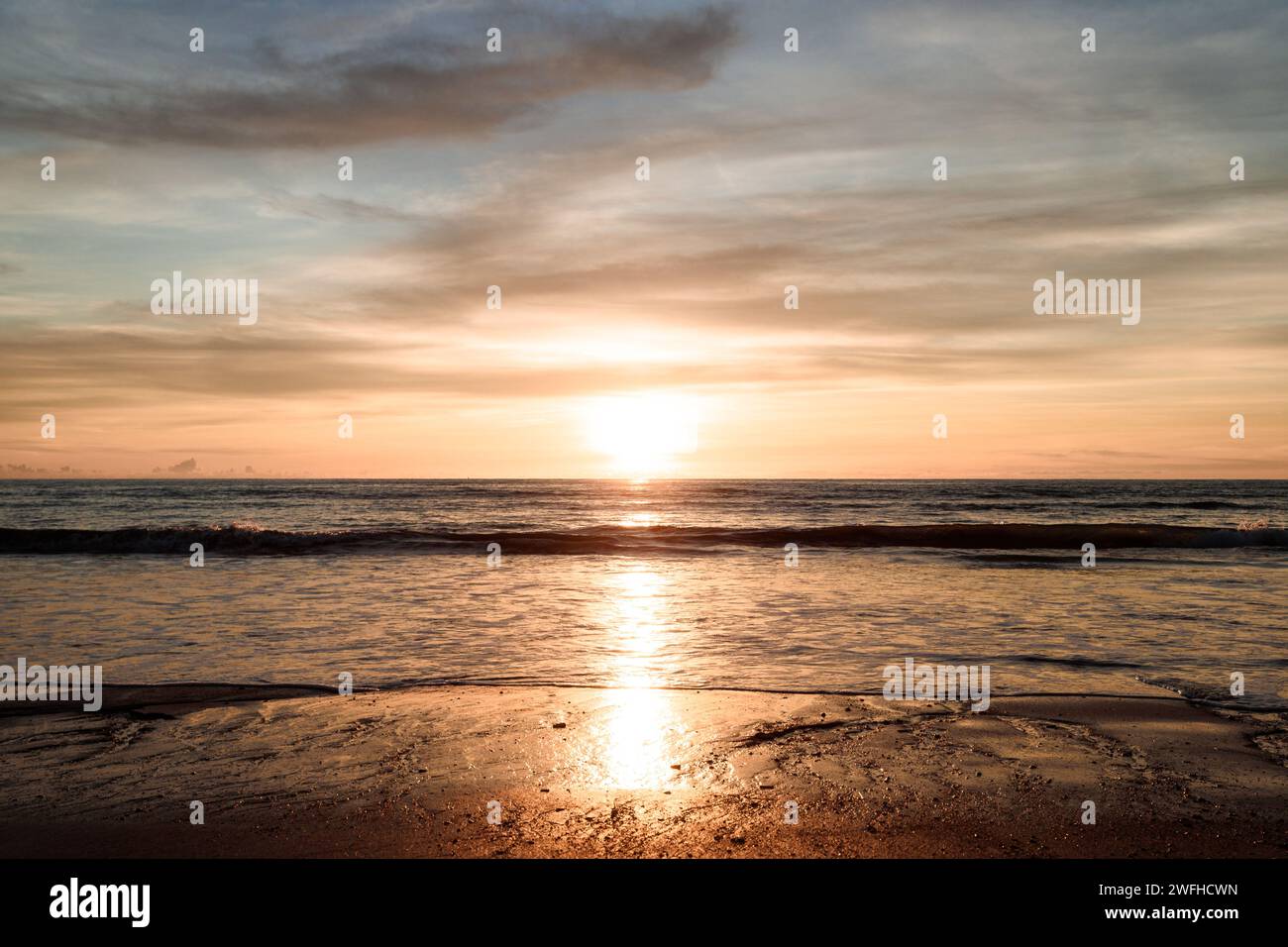 High contrast sunset over the beach Stock Photo - Alamy