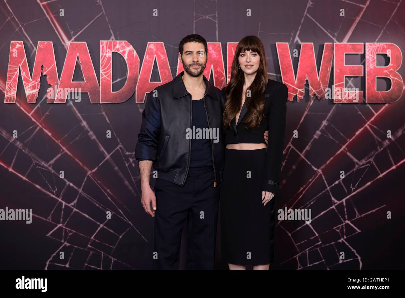 Tahar Rahim, left and Dakota Johnson pose for photographers during a ...