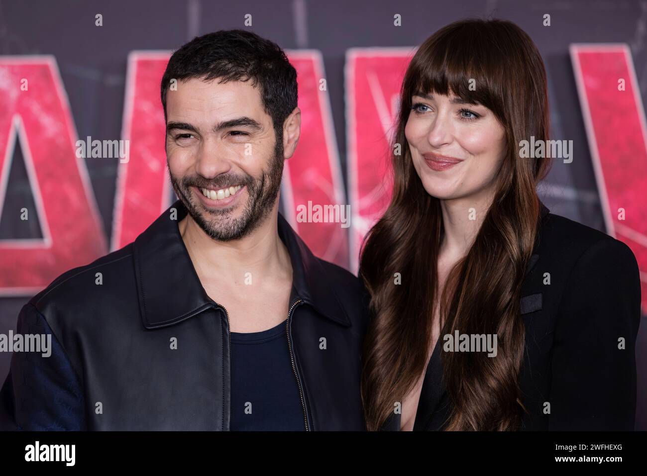 Tahar Rahim, left and Dakota Johnson pose for photographers during a ...